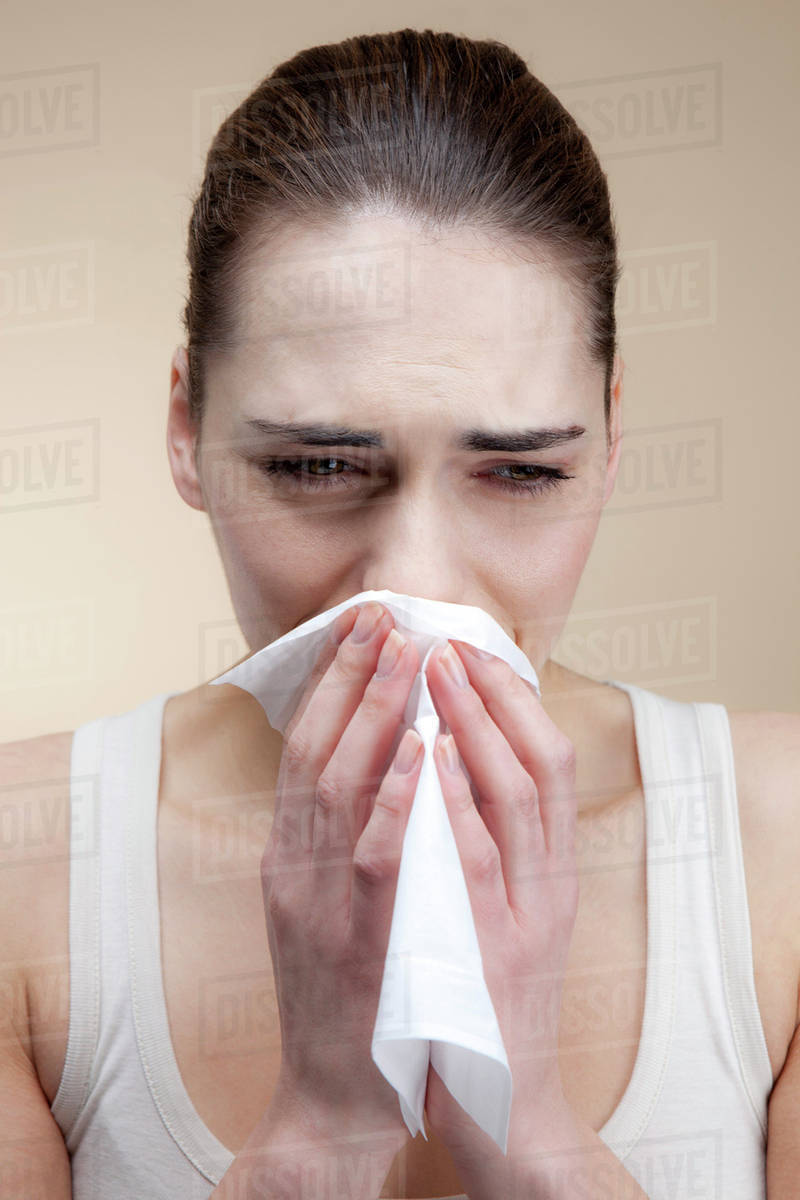 A sad woman crying and blowing her nose - Royalty-free Stock Photo ...