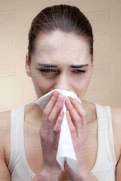A sad woman crying and blowing her nose - Royalty-free Stock Photo ...