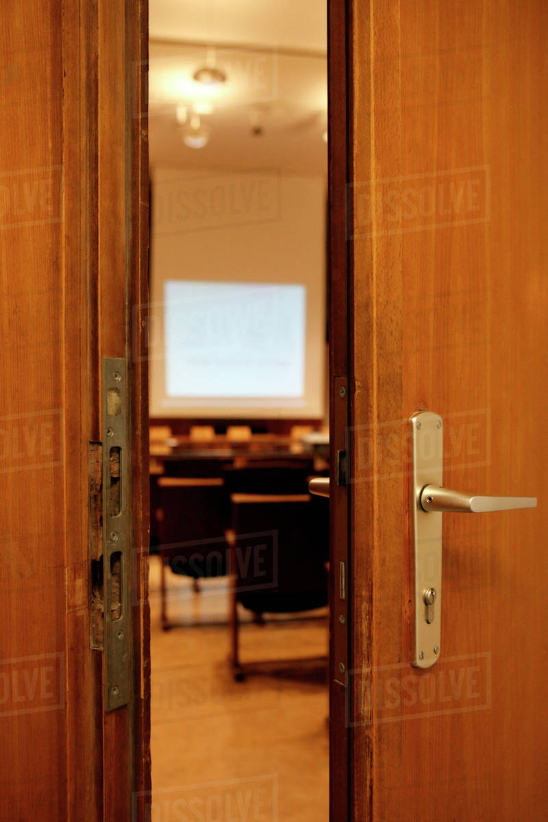 A door opening into a room - Stock Photo - Dissolve