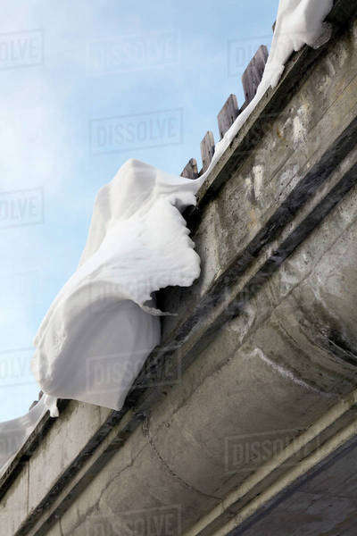 Snow on the eaves of a building, close-up, low angle view - Royalty ...