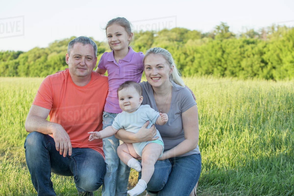 A family portrait taken in a field in a rural setting - Royalty-free ...