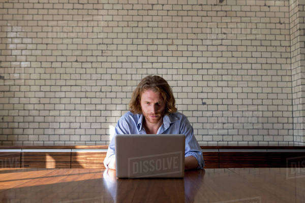 Man using laptop - Royalty-free Stock Photo | Dissolve