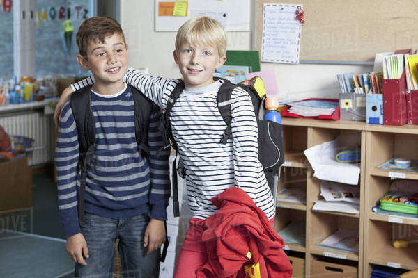Two Boys standing side by side in classroom - Royalty-free Stock Photo ...
