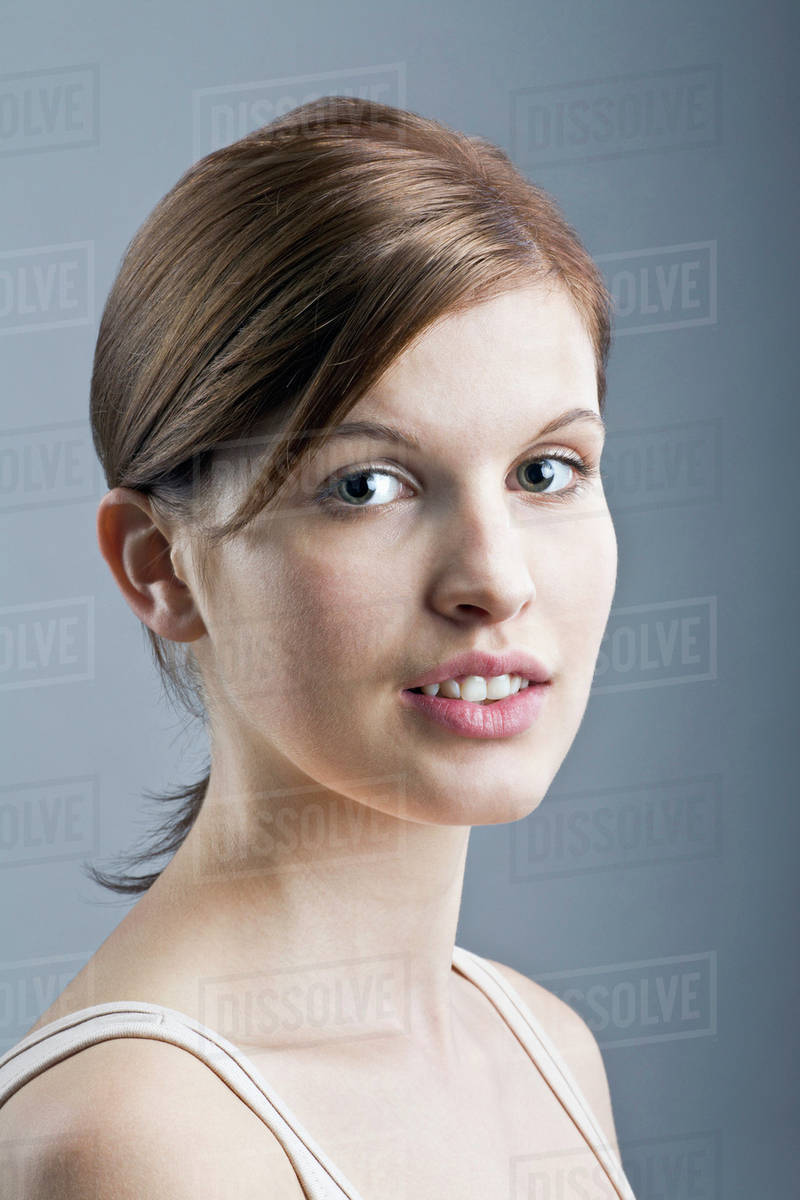 Young woman looking at camera, close-up - Royalty-free Stock Photo ...
