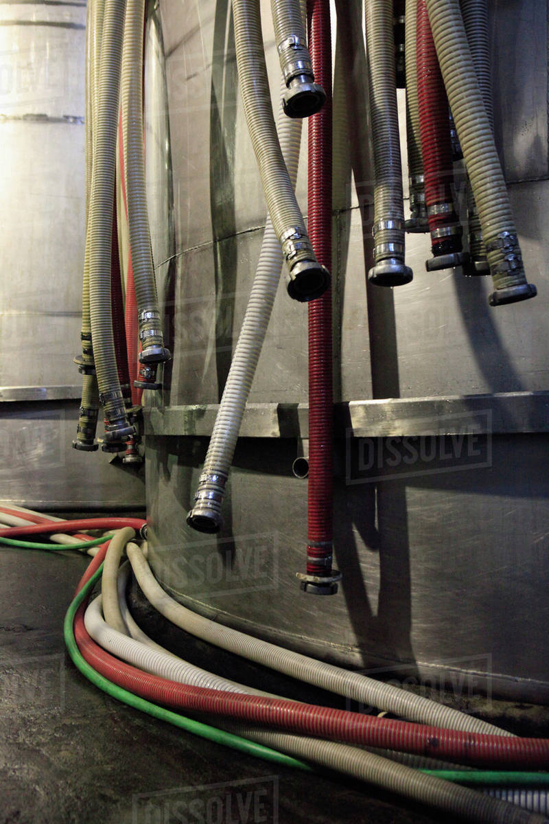 Pipes with connectors hanging on water tank - Royalty-free Stock Photo ...
