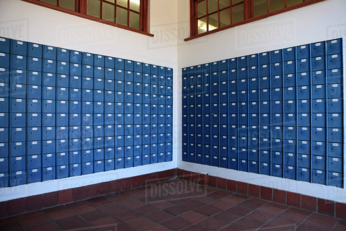 Locker room with blue lockers - Royalty-free Stock Photo | Dissolve