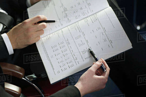 Business people checking document - Royalty-free Stock Photo | Dissolve