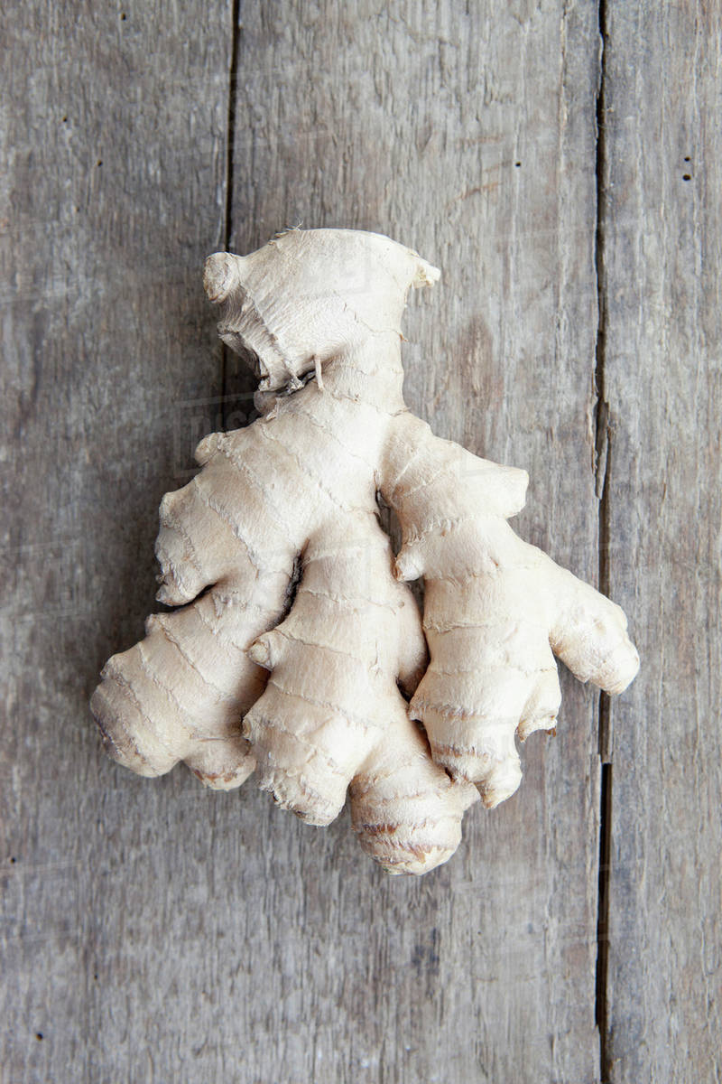 Ginger on wooden table - Royalty-free Stock Photo | Dissolve