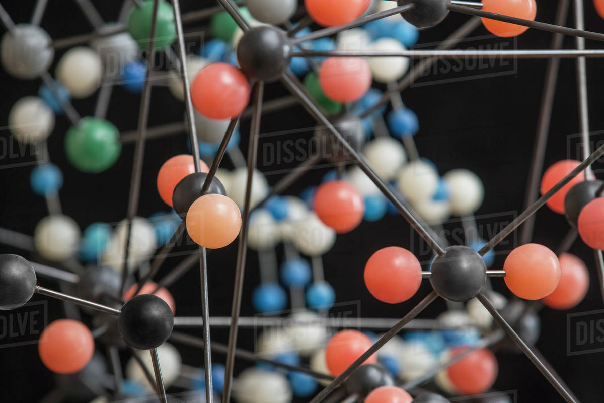 Close-up of multi colored molecular structure over white background ...