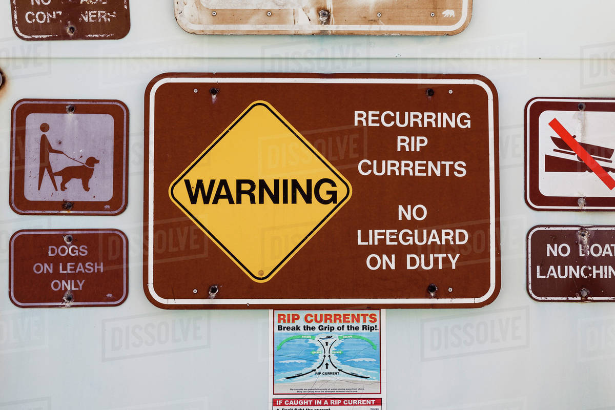 Warning signs on wall - Royalty-free Stock Photo | Dissolve