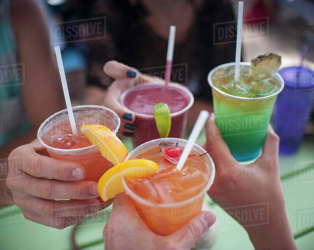 Cropped image of people holding drinks outdoors - Royalty-free Stock ...
