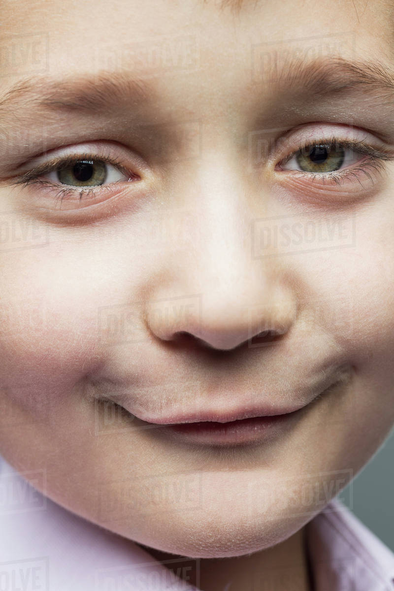 Close-up portrait of smiling boy - Royalty-free Stock Photo | Dissolve