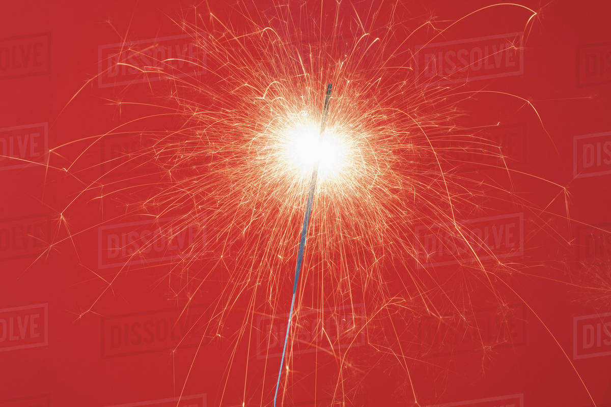 A lit sparkler - Royalty-free Stock Photo | Dissolve