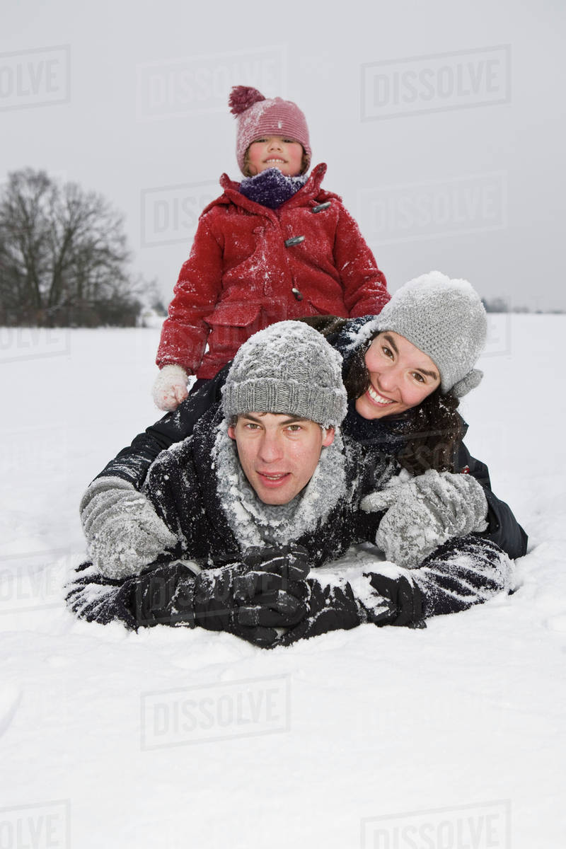 A family of three playing the in the snow - Royalty-free Stock Photo ...