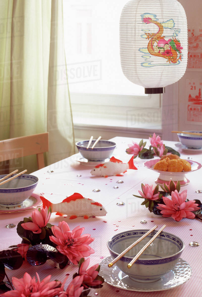 A table with place settings and Japanese decorations - Royalty-free ...