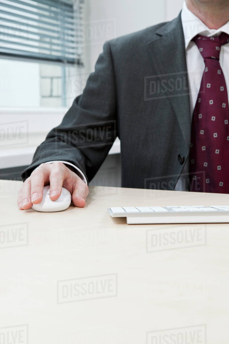 Businessman with mouse - Royalty-free Stock Photo | Dissolve