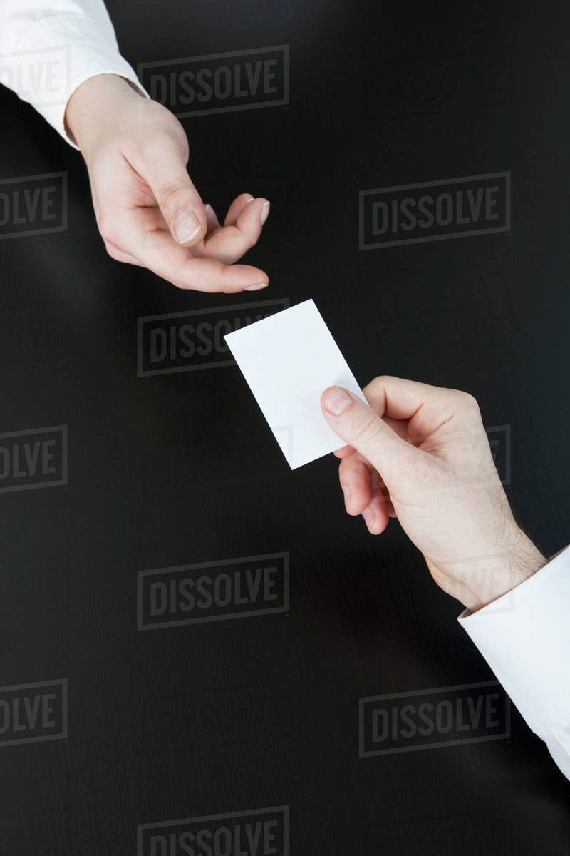 Businessmen pass the card - Royalty-free Stock Photo | Dissolve