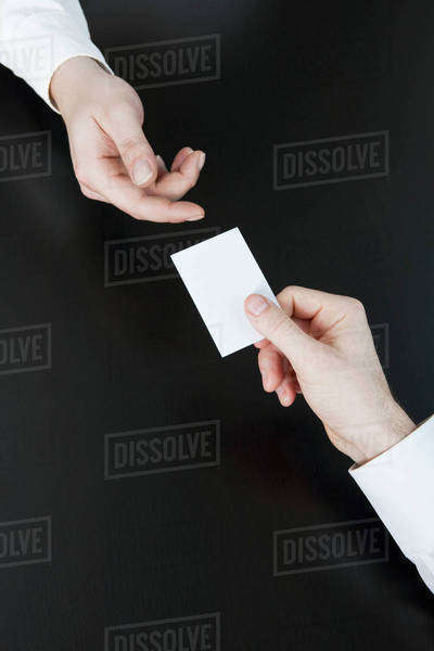 Businessmen pass the card - Royalty-free Stock Photo | Dissolve