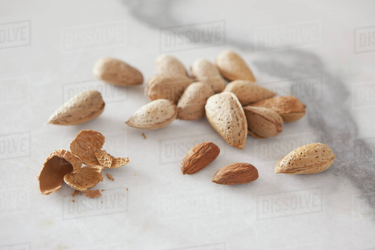 Close-up of almonds on white background - Royalty-free Stock Photo ...