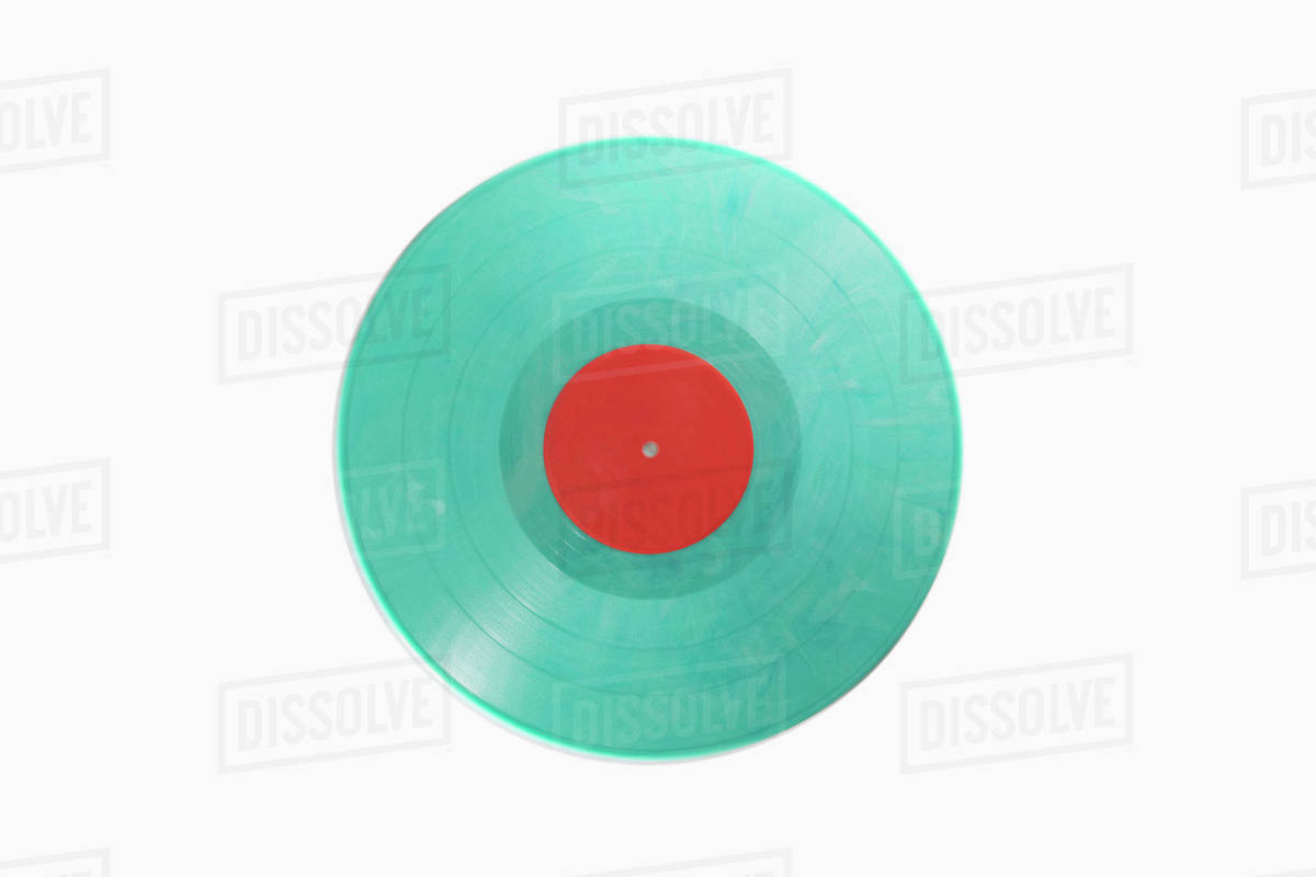 Close-up of blue record against white background - Stock Photo - Dissolve