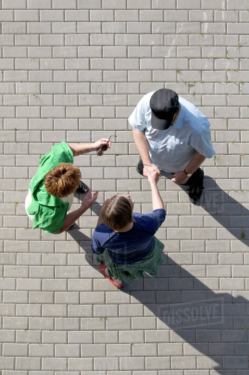 A man introducing a friend to another friend - Royalty-free Stock Photo ...