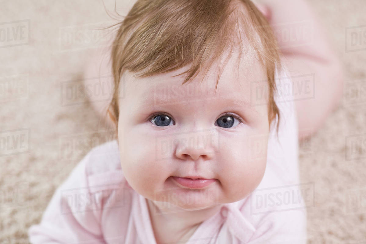 A baby looking at camera, portrait - Royalty-free Stock Photo | Dissolve