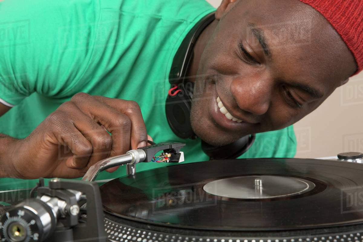 DJ using turntable - Royalty-free Stock Photo | Dissolve
