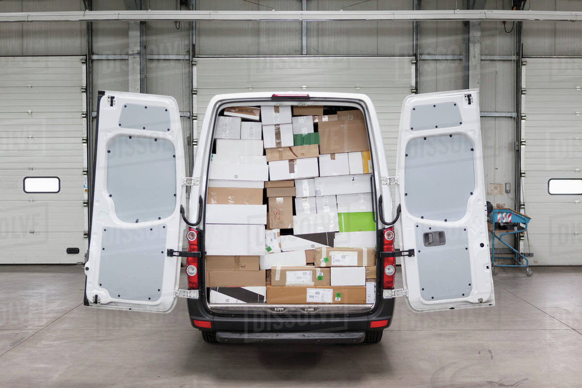 Boxes loaded in van at factory - Stock Photo - Dissolve
