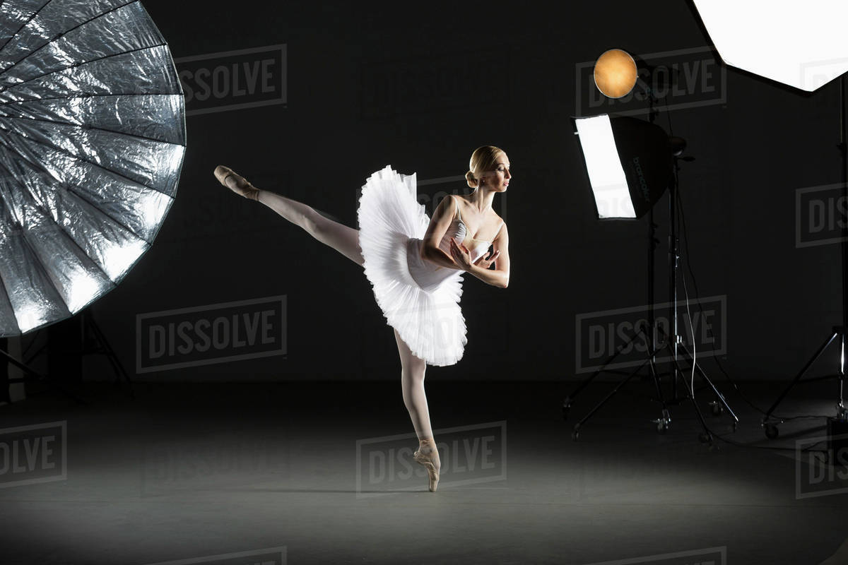 Full length of female ballet dancer performing at studio - Stock Photo ...