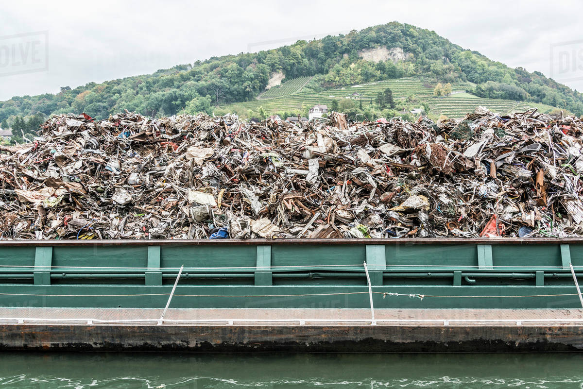 Heap of garbage at port - Stock Photo - Dissolve