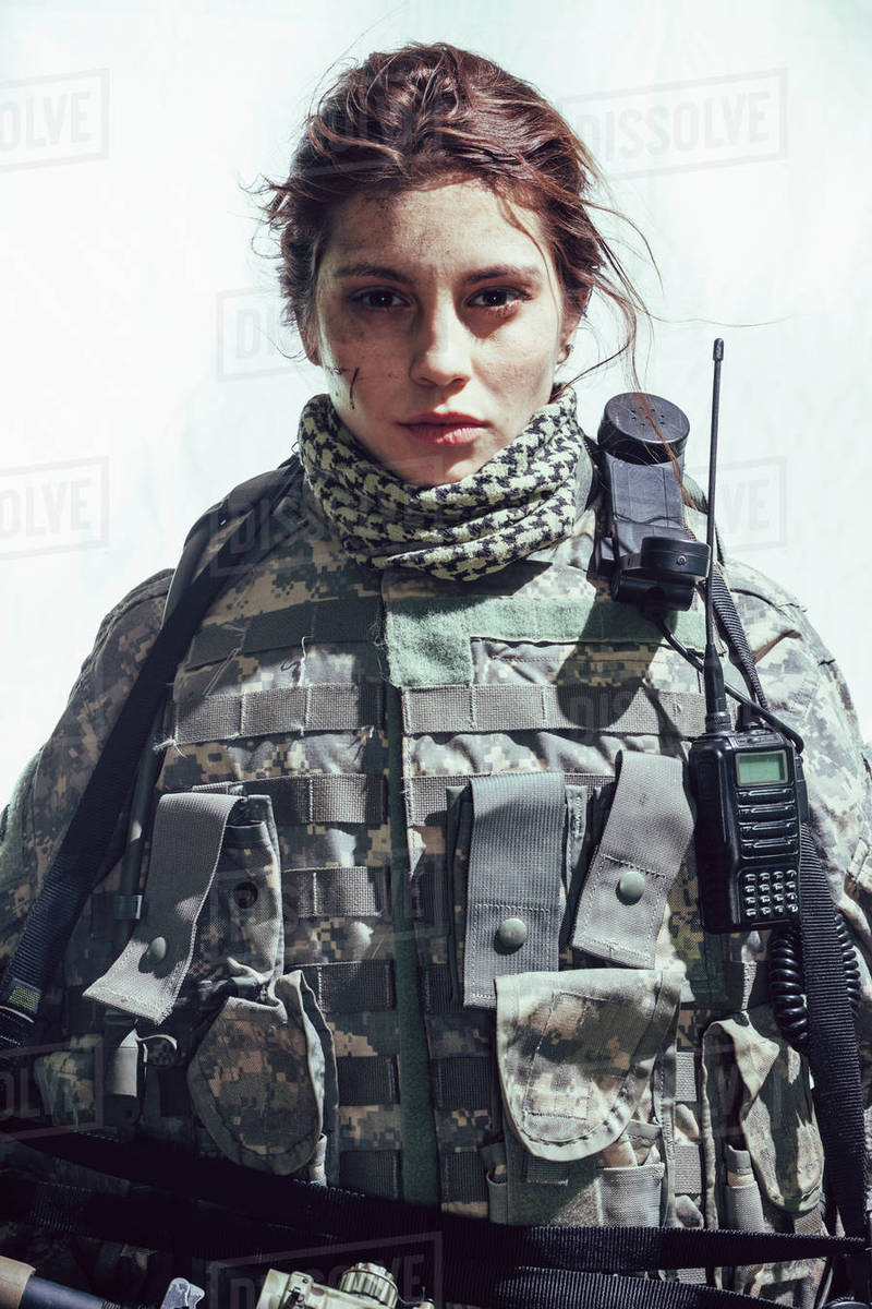 Portrait of army soldier standing against white background - Stock ...