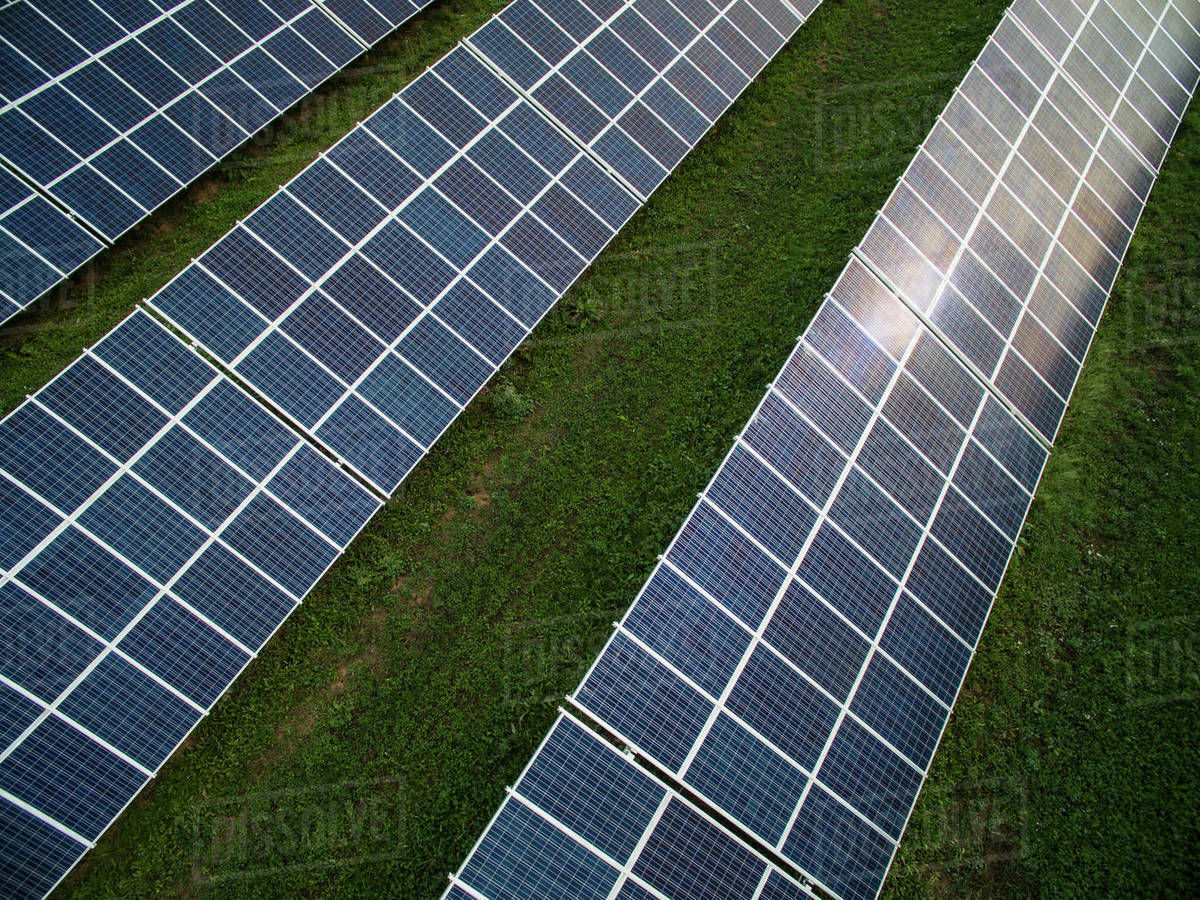 High angle view of solar panels in field - Royalty-free Stock Photo ...