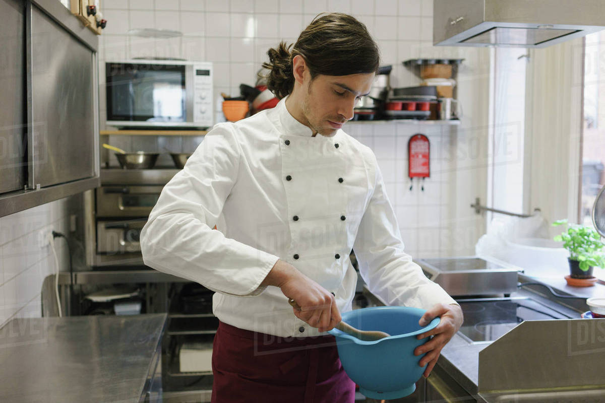 Chef cooking in commercial kitchen at cafe - Royalty-free Stock Photo ...