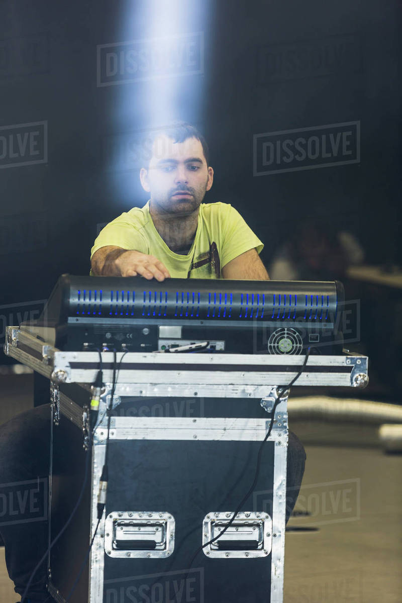 Concentrated of man with sound mixer sitting in studio - Royalty-free ...