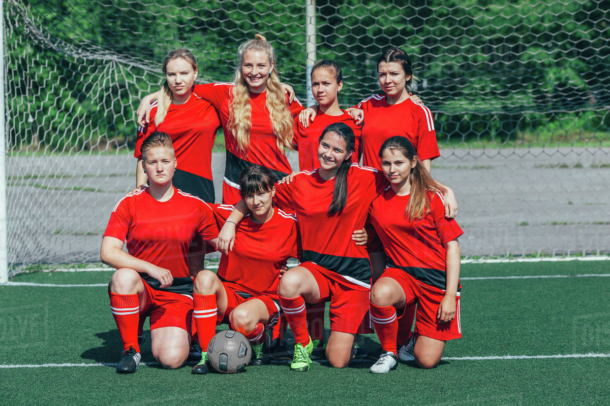 Portrait of soccer team on field against net - Royalty-free Stock Photo ...