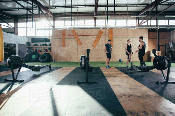 Male athletes talking in health club - Royalty-free Stock Photo | Dissolve