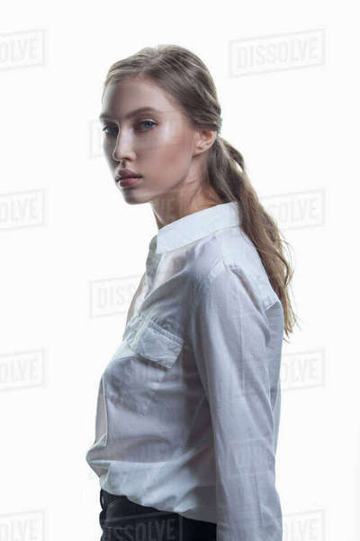 Side view portrait of beautiful fashion model against white background ...