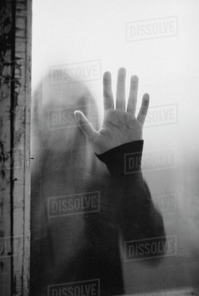 Teenage girl touching glass window of lookout tower - Stock Photo ...