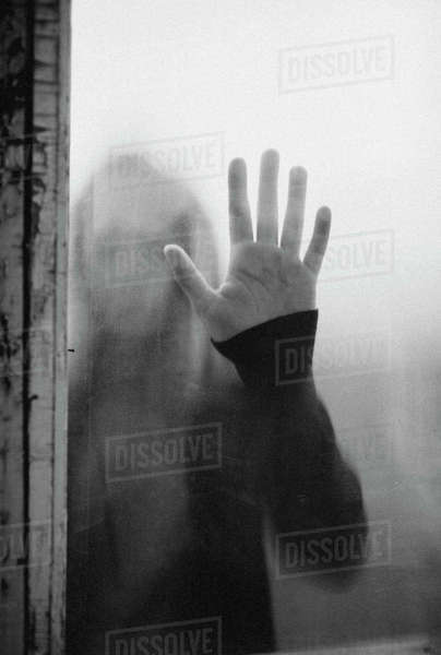 Teenage girl touching glass window of lookout tower - Stock Photo ...