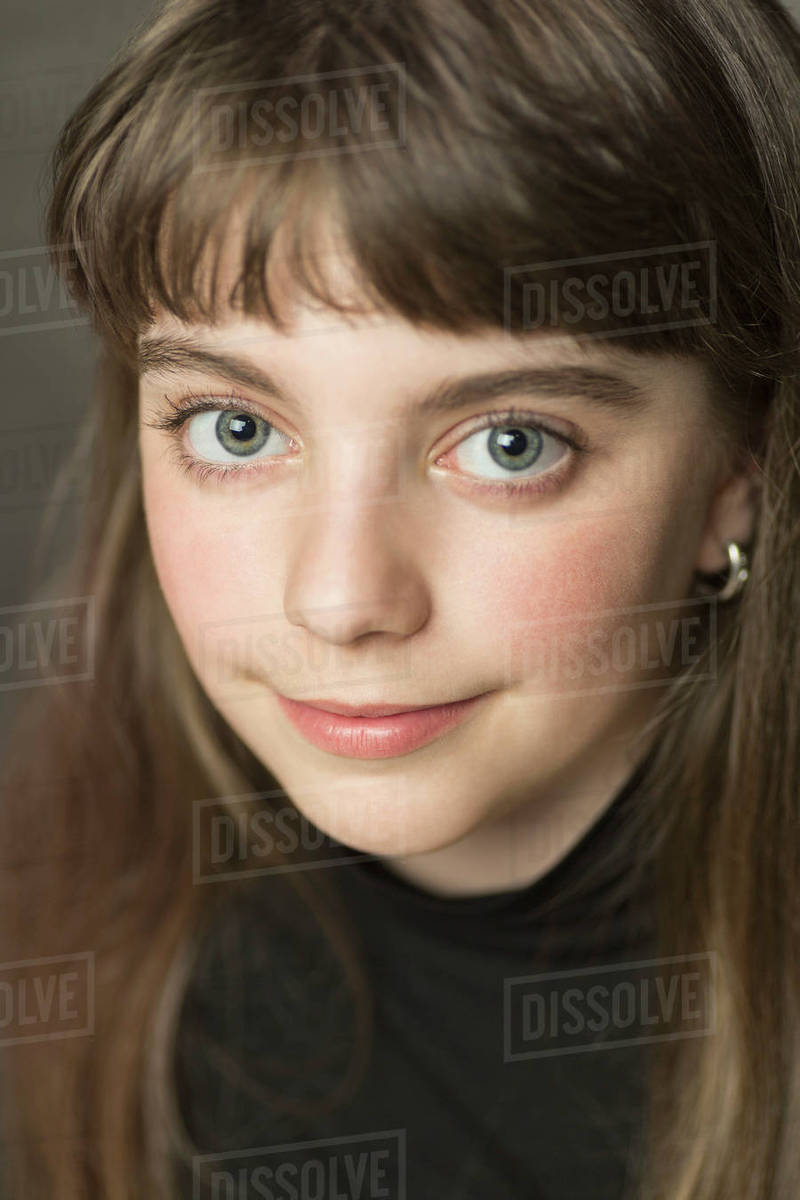 Close-up portrait of smiling girl with long brown hair - Royalty-free ...