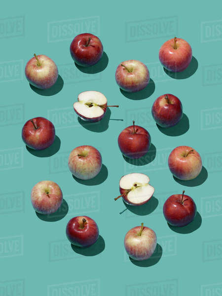 High angle view of apples on blue background - Stock Photo - Dissolve