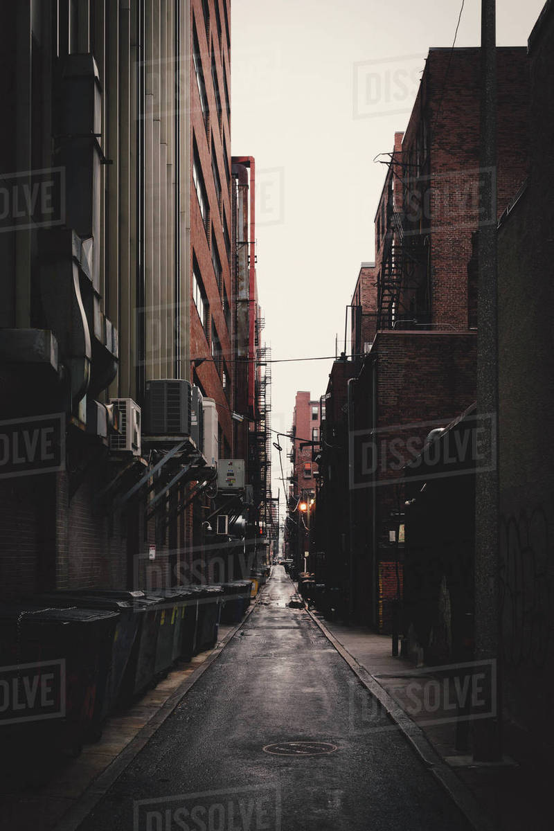 Long alley amidst buildings in city, New York City, New York, USA ...