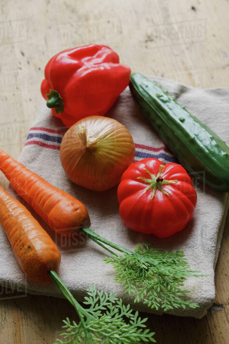 Plastic vegetables on towel - Royalty-free Stock Photo | Dissolve