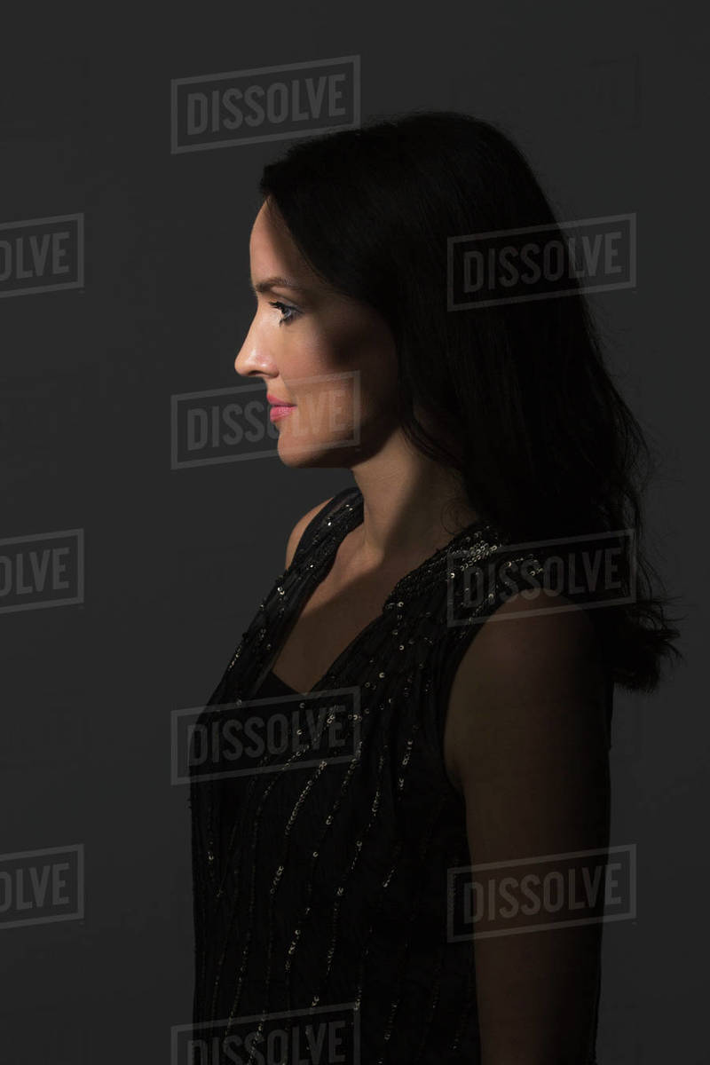 Portrait of beautiful woman in side profile and amidst shadow - Royalty ...