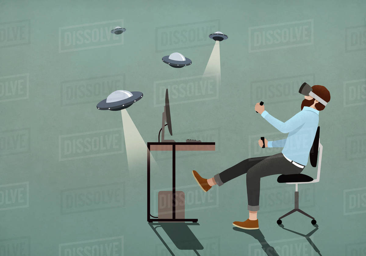 Man playing UFO video game with virtual reality simulator glasses ...