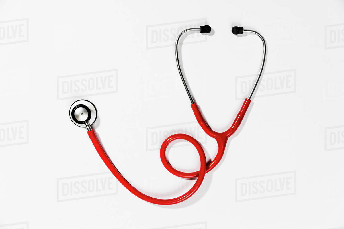 Red stethoscope on white background - Stock Photo - Dissolve