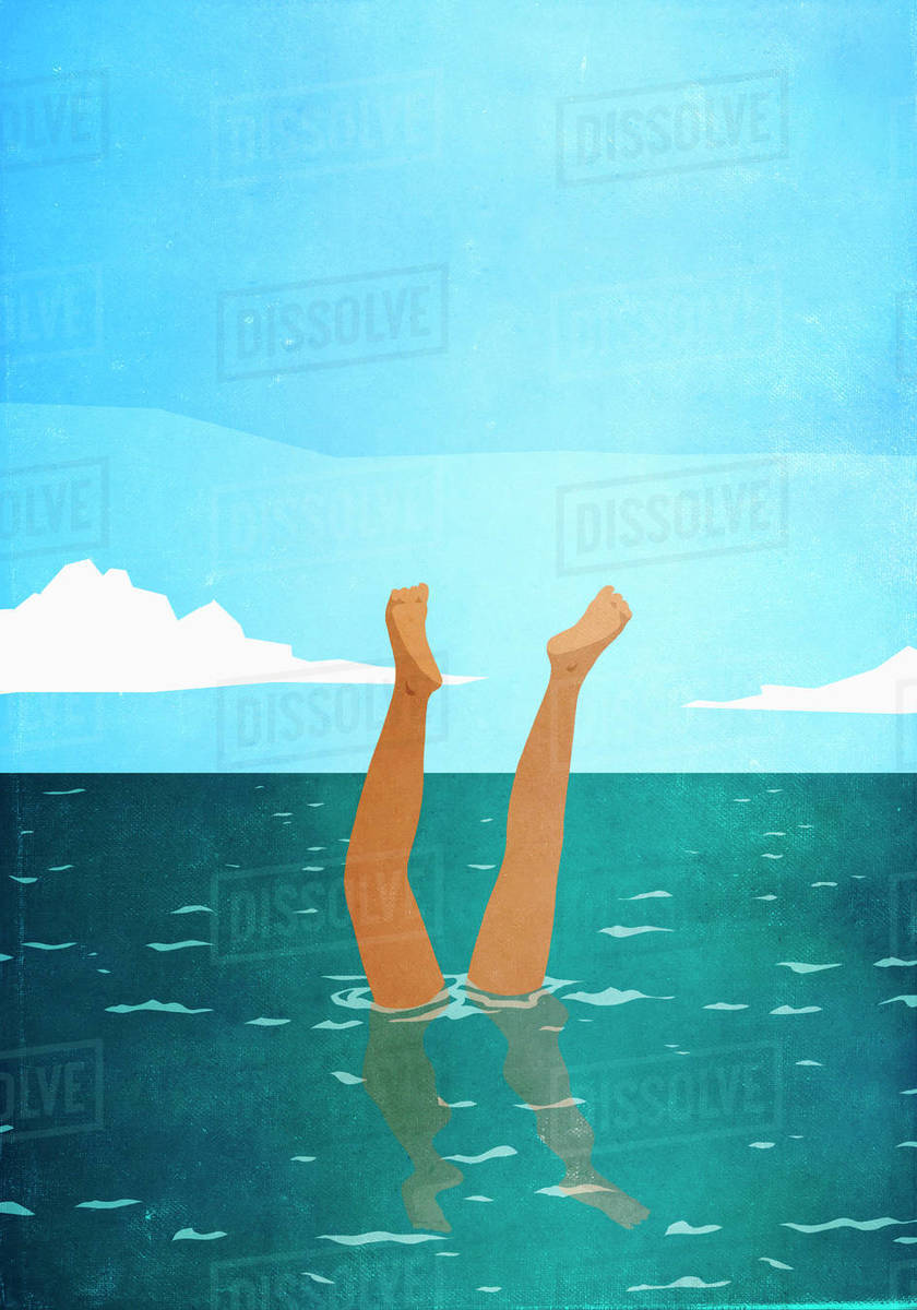 Woman doing handstand underwater in ocean - Stock Photo - Dissolve