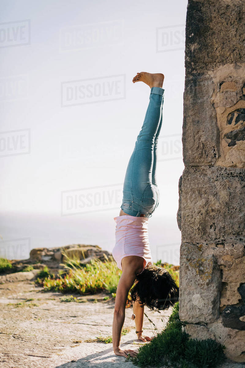 Woman doing handstand - Royalty-free Stock Photo | Dissolve