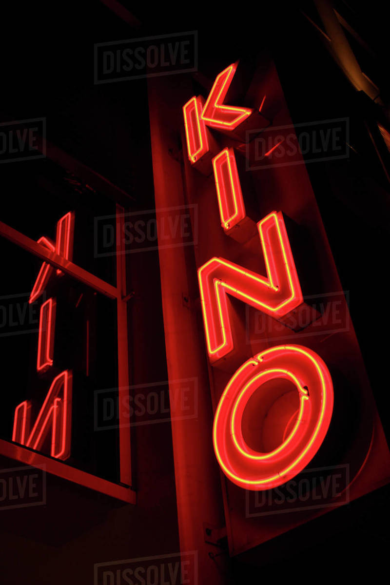 Neon red movie theater sign, Berlin, Germany - Stock Photo - Dissolve