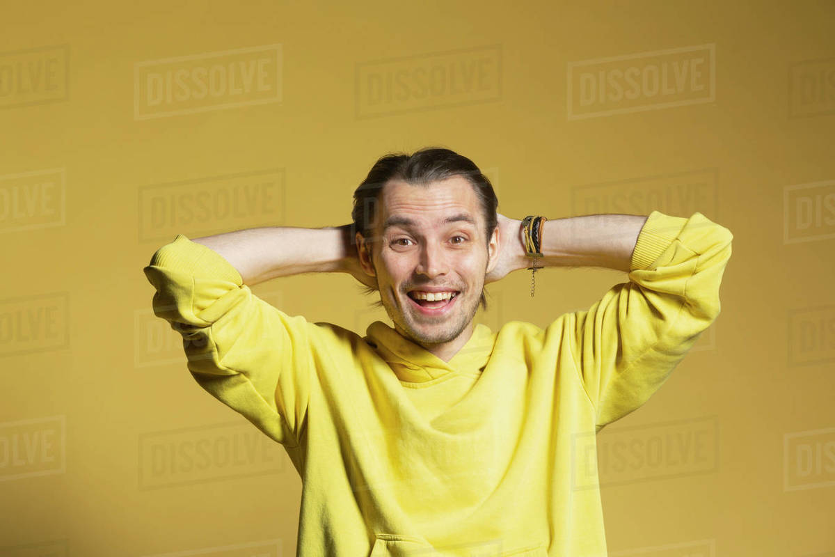 Portrait excited, happy young man on yellow background - Stock Photo ...
